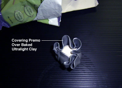 Floating Polymer Clay Test: Covering Water Filled Frozen Balloon, Cork ...